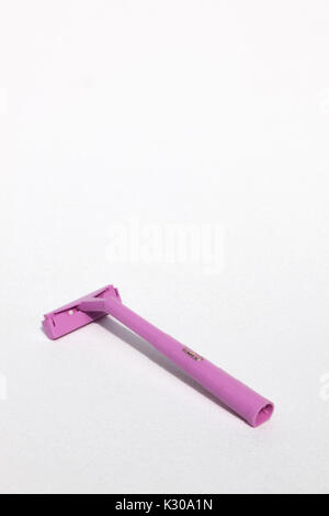 Pink disposable razor Stock Photo - Alamy