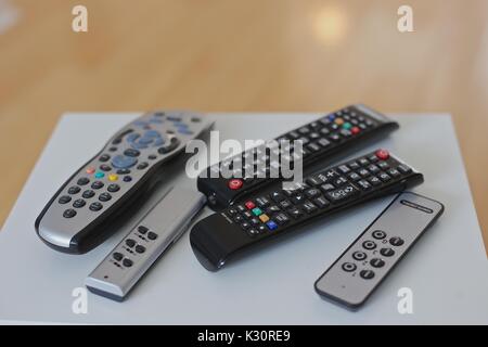 Too many remote controls Stock Photo - Alamy