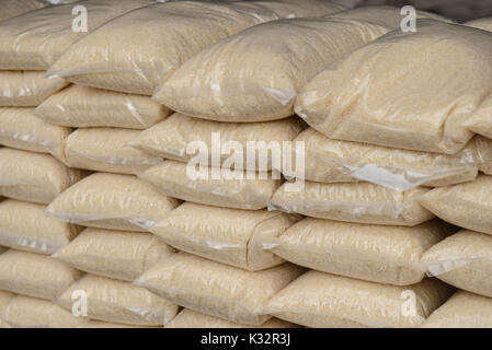 rice packing in plastic bag on conveyor line ; close up Stock Photo - Alamy