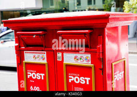 Red Australia Post mail box close up on a suburban Melbourne street ...