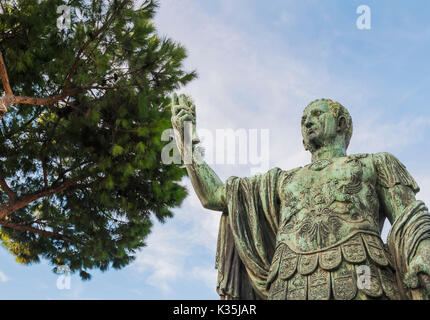 A Roman statue of Julius Caesar holding a scroll in the Louvre Museum ...