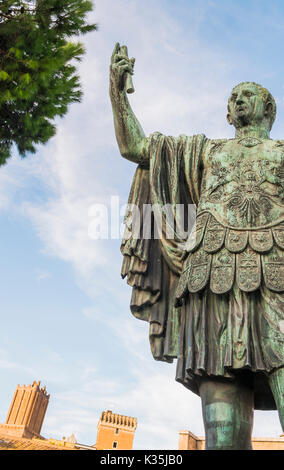 A Roman statue of Julius Caesar holding a scroll in the Louvre Museum ...