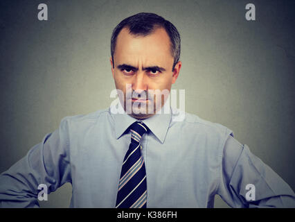 Angry and grumpy, displeased strict or serious male with beard, wear ...