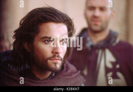 KINGDOM OF HEAVEN ORLANDO BLOOM, as Balian, left with sword, leads his ...