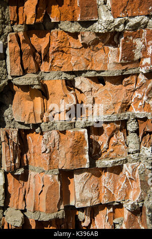 Grunge texture. Mortar-covered red brick wall with very old and cracked ...