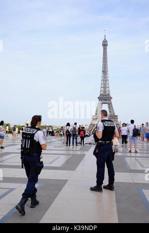 Armed French police patrol the streets of Paris and the Eiffel Tower in ...
