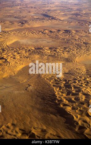 Aerial view of the massive red dunes and sabkha flats near the Shaybah ...