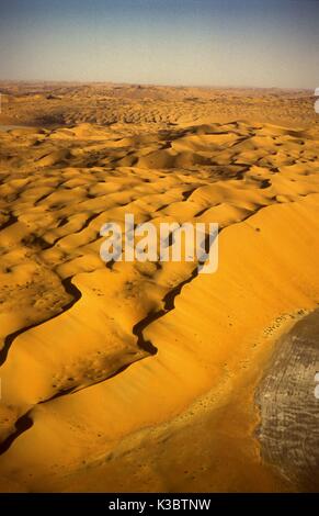 Massive red sand dunes at Saudi Aramco's Shaybah field, a major gas and ...