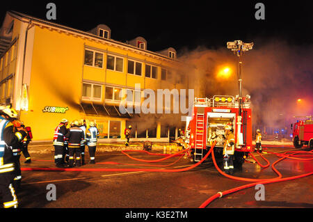 Fire brigade, commercial building, conflagration, night Stock Photo - Alamy