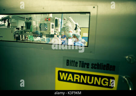 Operating Theatre In Use sign Stock Photo - Alamy