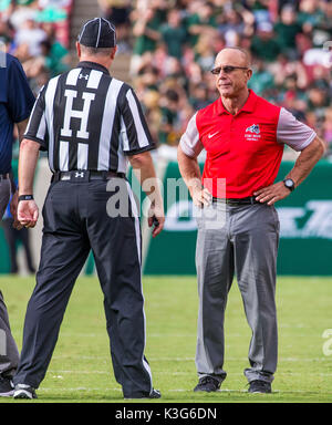 Stony Brook head coach Chuck Priore talks with his assistants on the ...