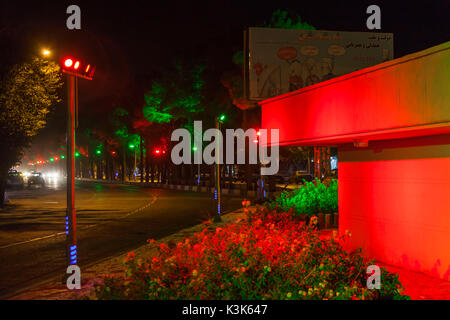 Iran, Central Iran, Abadeh, city rest stop colorfully lit, evening ...