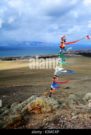 Buryat traditional pagan holy poles by Lake Baikal. A row of vertical ...