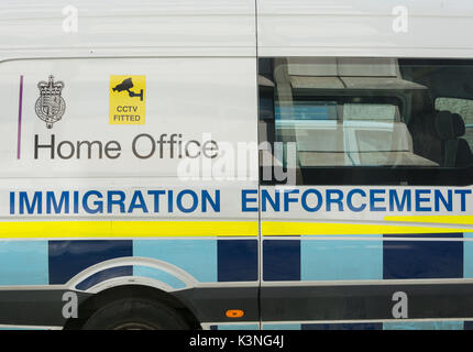 Home Office Immigration Enforcement vans parked outside a building in ...