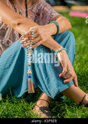 Close up of a hand mudra and mala beads Stock Photo - Alamy