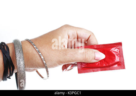Woman holding a condom Stock Photo - Alamy