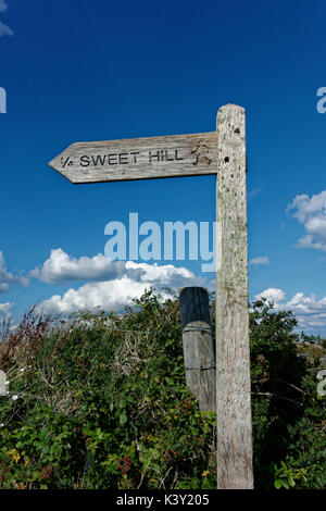 A Wooden Signpost on the Isle of Portland, Dorset, England Stock Photo ...