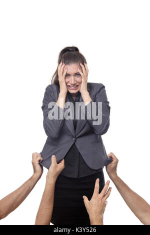 business woman being pulled down by hands all around her Stock Photo ...