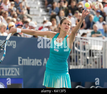Sloane Stephens of the U.S. returns the ball to Italy's Camila Giorgi ...