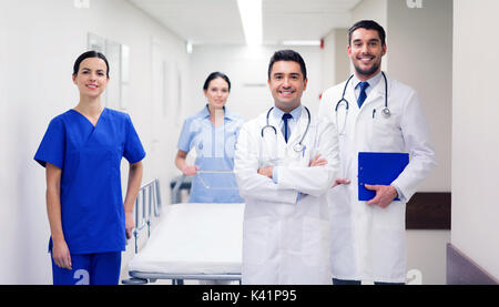 group of happy doctors with gurney at hospital Stock Photo - Alamy