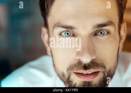 Portrait of delighted male that looking forward Stock Photo - Alamy