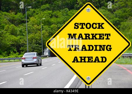Stock Market just ahead road sign on sky background Stock Photo - Alamy