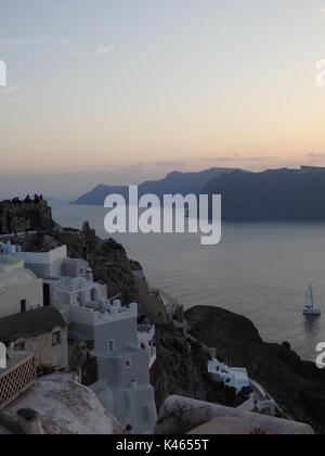 The Famous Oia Sunset overlooking Oia Castle in Santorini, Greece ...