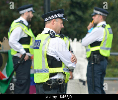 Metropolitan Police officer in high vis jacket patrolling on a BMW ...