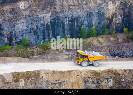 Quarry vehicle dwarfed by the shear expanse and size of Halkyn Quarry ...