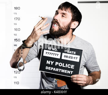 Bearded man in jail or prison. Men in a cage outdoor. danger or ...