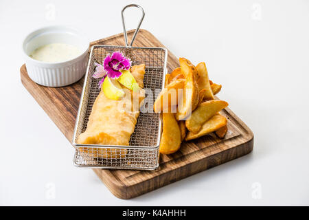 Hake fillet fried in batter. Sauce, fresh rosemary. Vegetarian healthy ...