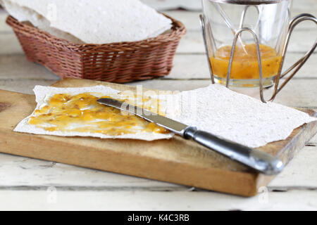 Norwegian flatbrod with cloudberry jam on shabby table Stock Photo - Alamy