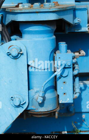 Blue hydraulic cylinder from a construction vehicle Stock Photo - Alamy
