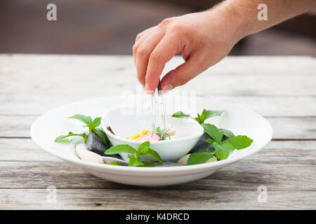 Closeup of human hands cooking in kitchen. Women discuss a menu using ...