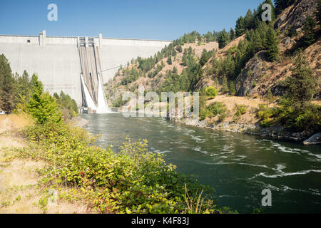 Water in dam concrete spillway infrastructure at reservoir. Waterfall ...
