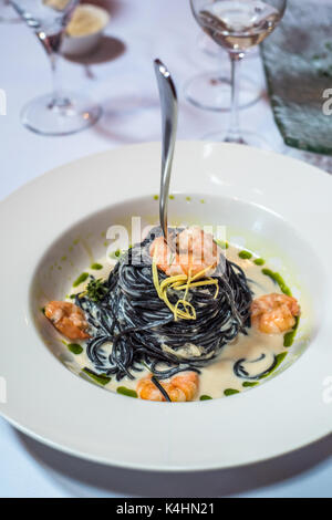Black seafood pasta spaghetti Stock Photo - Alamy