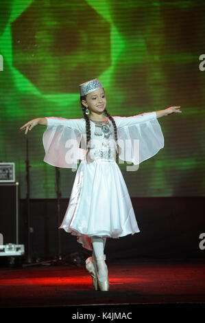 A Crimean tatar singer in native dress performing on stage. Concert at ...