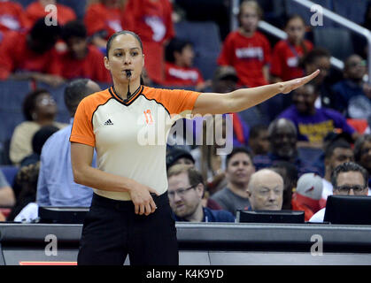 A referee signals during the second half of an NFL preseason football ...