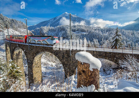 Switzerland Grisons Filisur red train of Rhaetian Railway Company on ...