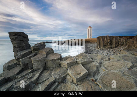 Basalt columns and the Kálfshamarsvík lighthouse near Skagaströnd on ...