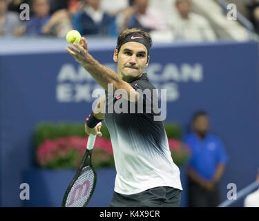 Roger Federer of Switzerland serves to Juan Martin Del Potro of ...
