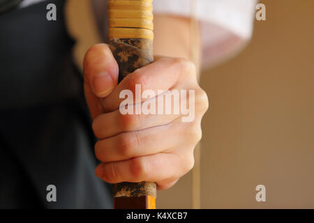 Japanese traditional archery athlete hand holding bow Stock Photo - Alamy