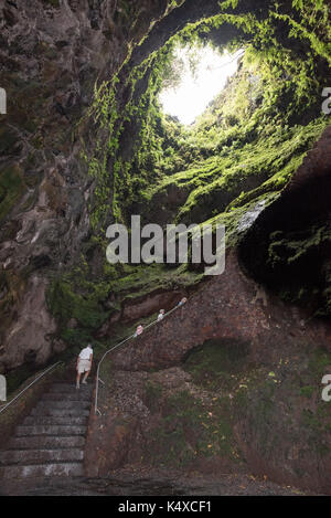 People visiting Gruta do Carvao lava tube cave. Sao Miguel island ...