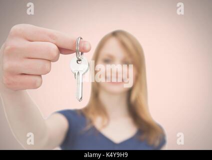 Digital composite of Woman holding key in front of Vignette Stock Photo ...