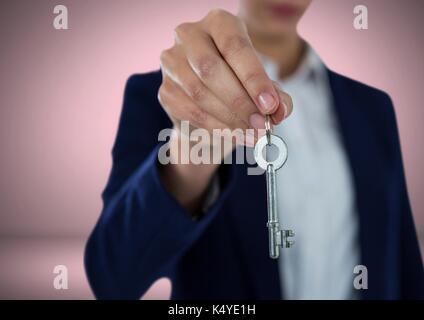 Digital composite of Woman holding key in front of Vignette Stock Photo ...
