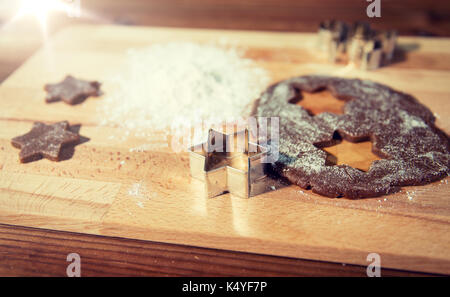 close up of ginger dough, molds and flour on board Stock Photo - Alamy