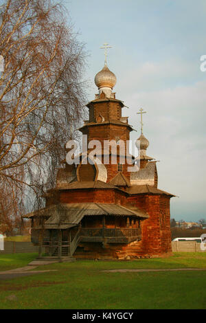 Traditional Slavonic village with wooden orthodox church and house with ...