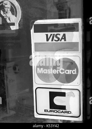 Visa, MasterCard and Eurocard payment options sign in retail shop ...