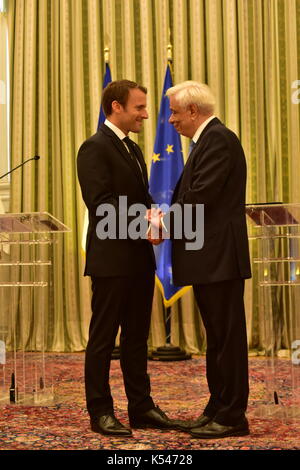 Handshake between French President Emmanuel Macron and Cyprus President ...
