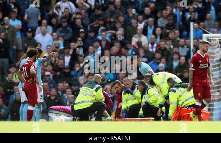 Manchester City goalkeeper Ederson receives treatment for an injury ...
